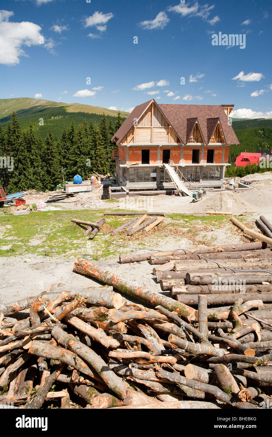 Building a house in a remote location, on a mountain with a beautiful ...