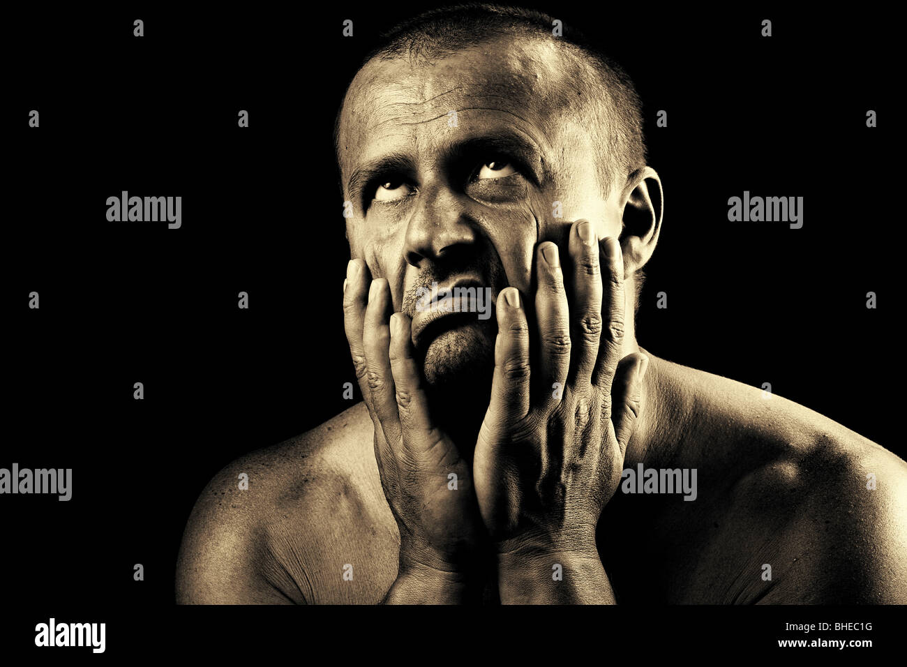 Powerful toned monochrome portrait of a worried young man, isolated on ...