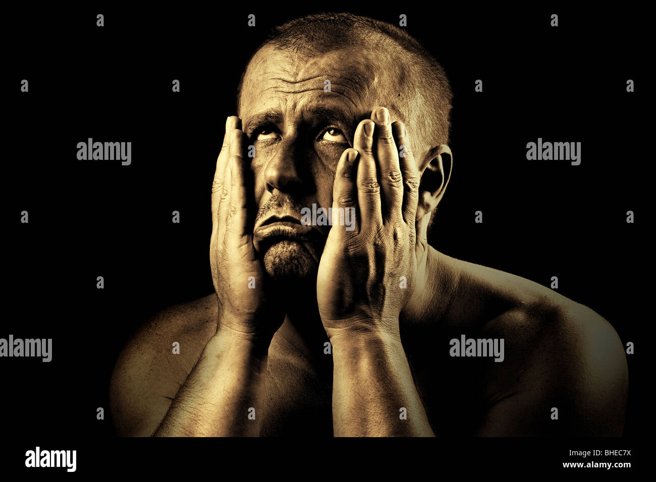Powerful toned monochrome portrait of a worried young man, isolated on ...