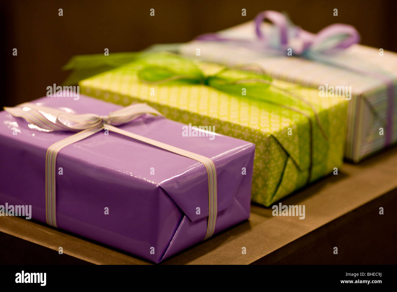 Three presents on a table Stock Photo - Alamy