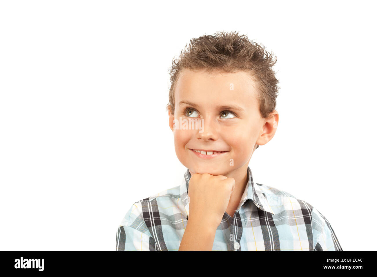 Adorable little boy looking up, isolated on white background Stock ...
