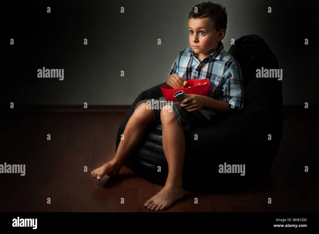 Cute kid getting scared while watching a scary movie Stock Photo - Alamy