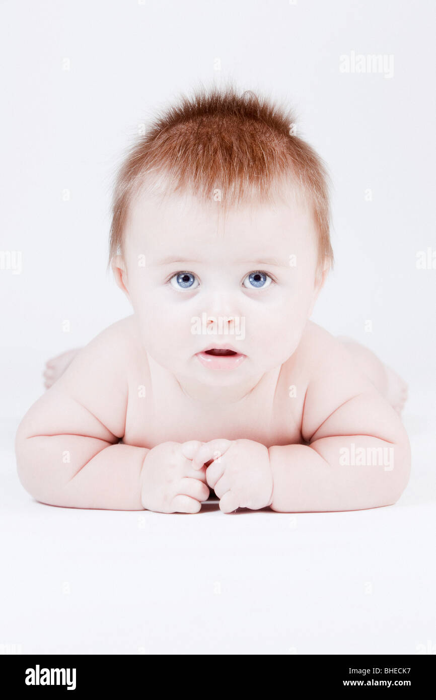 A colour color photograph of a white Caucasian male baby aged seven ...