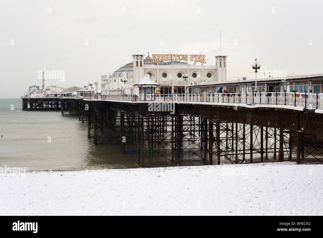 Snow on Brighton Beach, in front of Brighton Pier, England Stock Photo ...