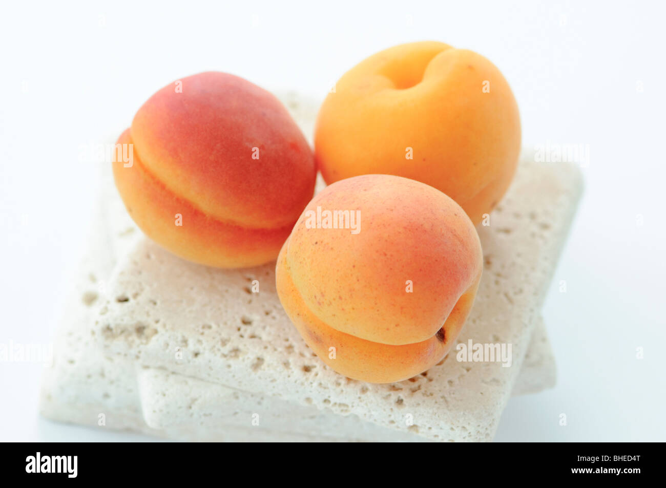 Three fresh raw apricots Stock Photo - Alamy