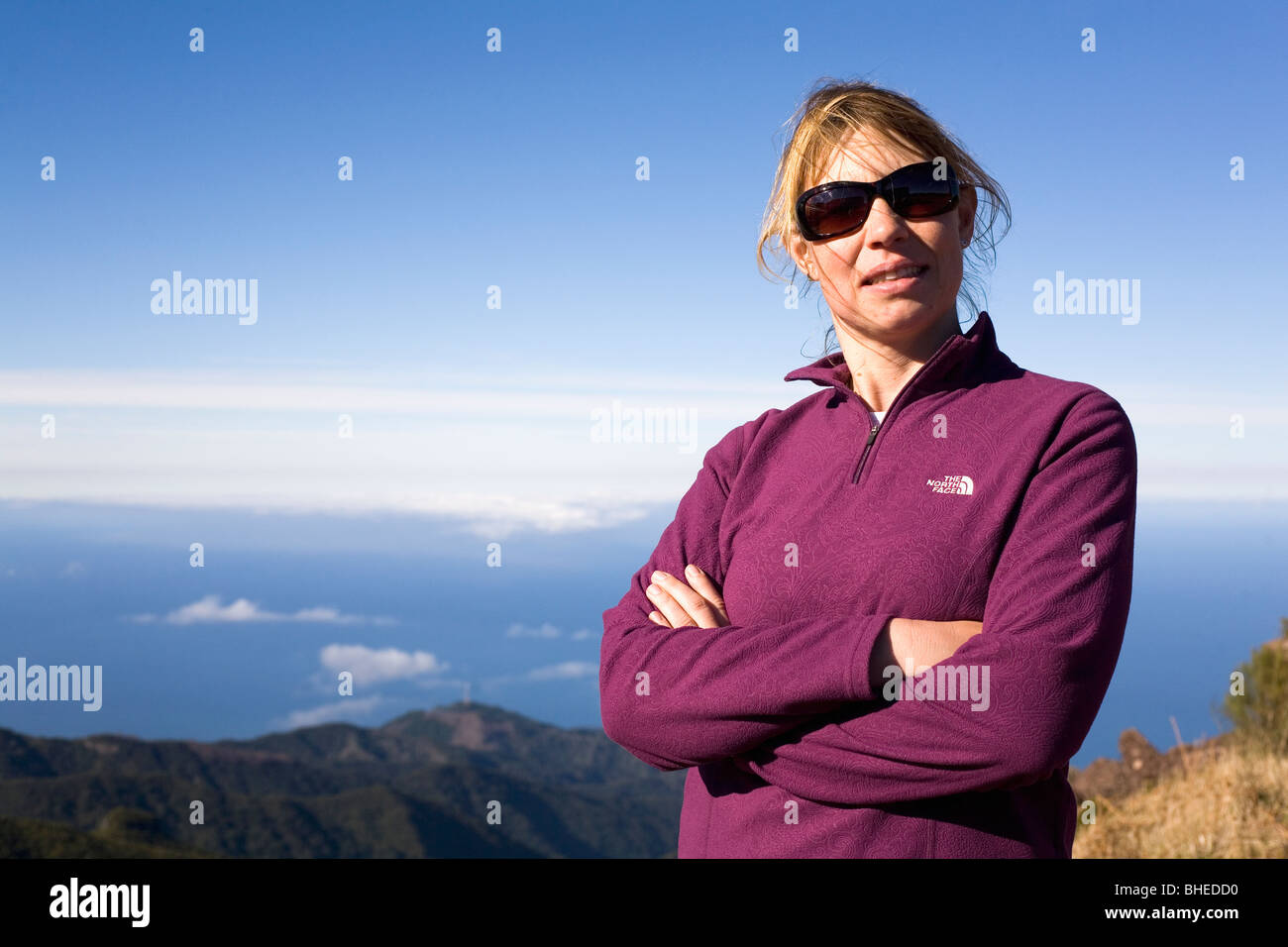 Woman wearing sunglasses stands hi-res stock photography and images - Alamy