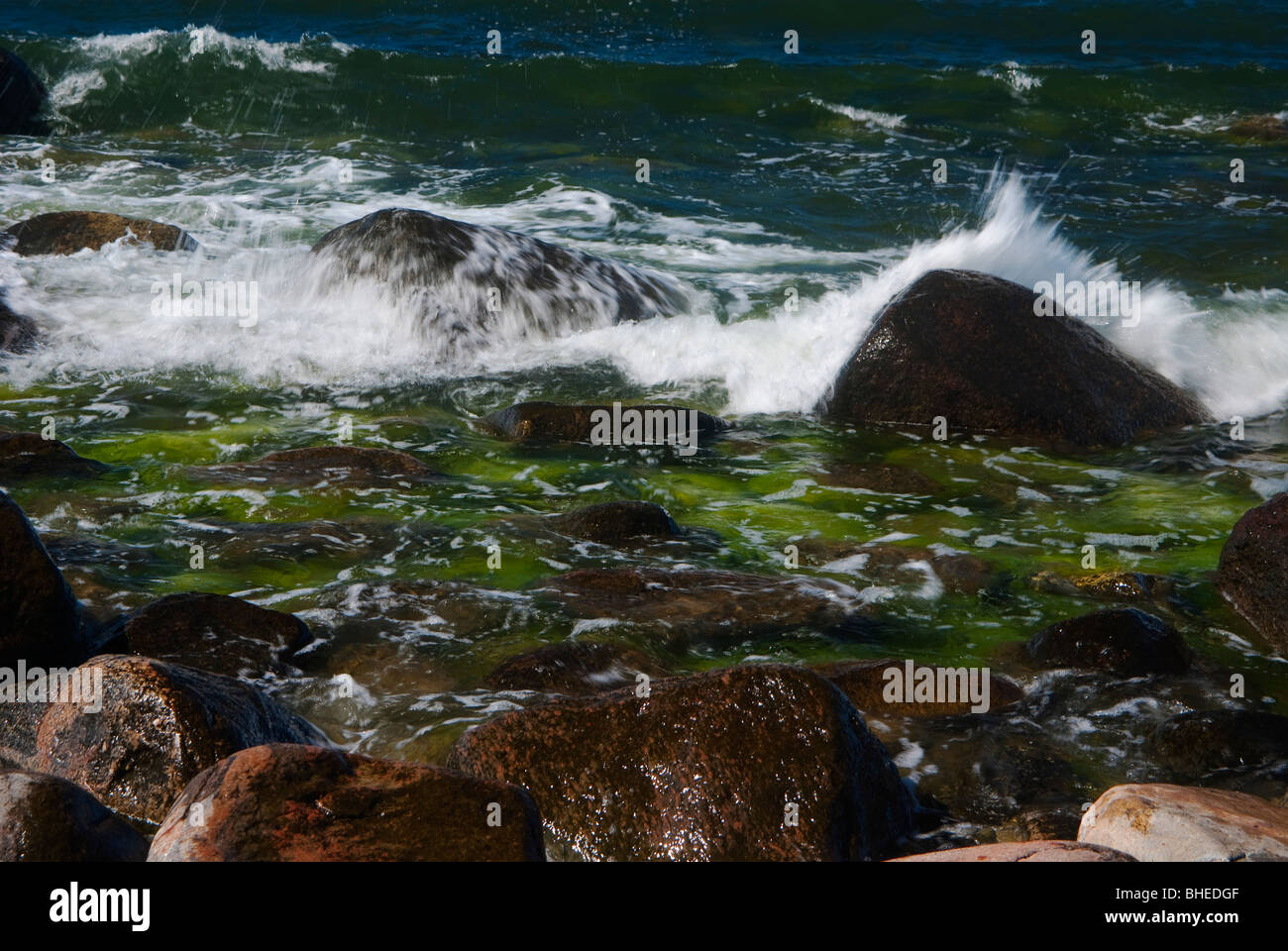 Wave hitting the stone Stock Photo - Alamy