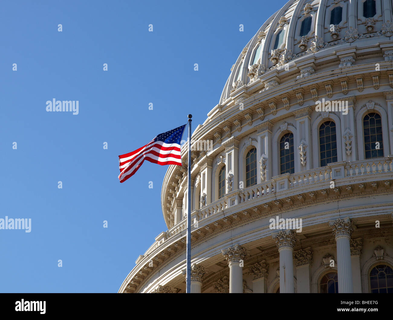 The United States Capitol dome and flag in Washington DC Stock Photo ...