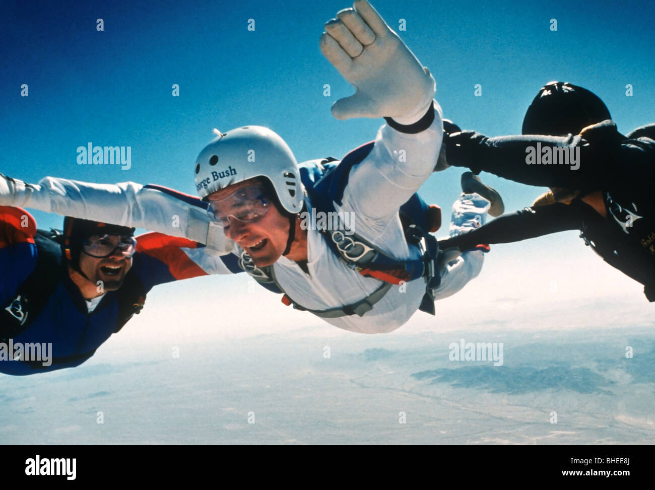 President George H.W. Bush free falls during a parachute jump to ...