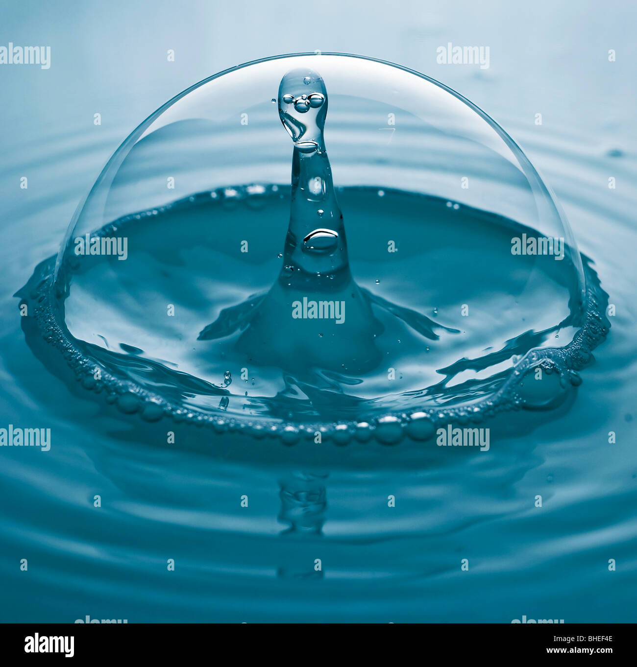 the splashing water drop inside of a soap bubble Stock Photo - Alamy