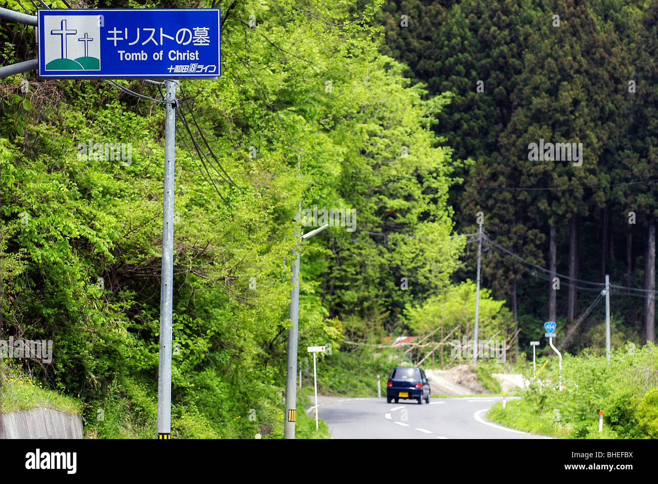 A road sign points visitors toward Christ's tomb in Shingo, Japan Stock ...