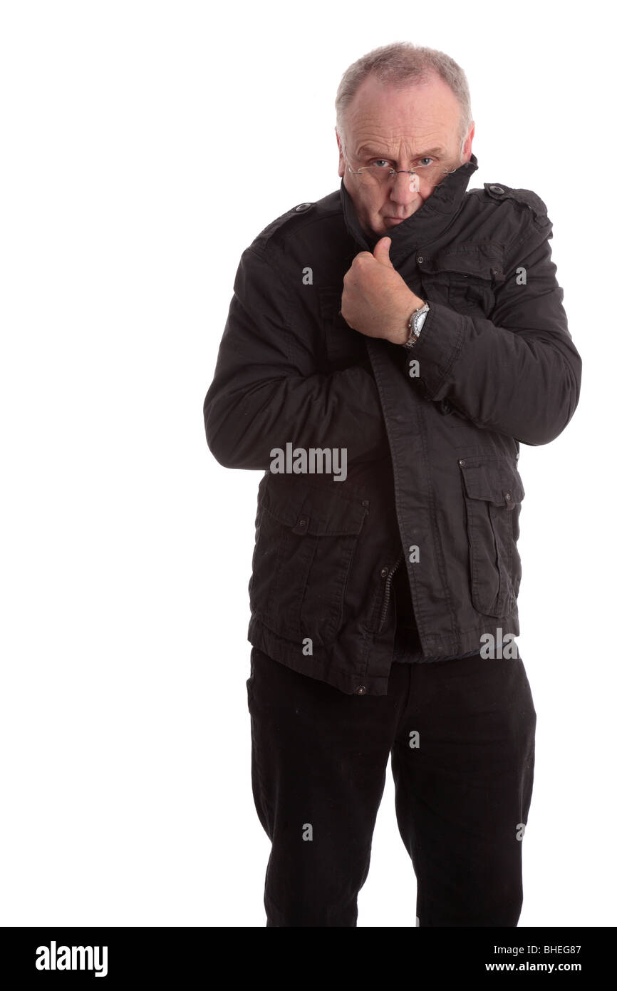 Man holding jacket closed cold hi-res stock photography and images - Alamy