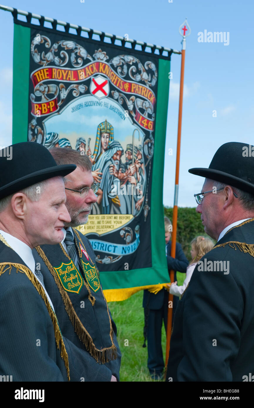 Minister of Cluture, Nelson McCausland in conversation with two members ...