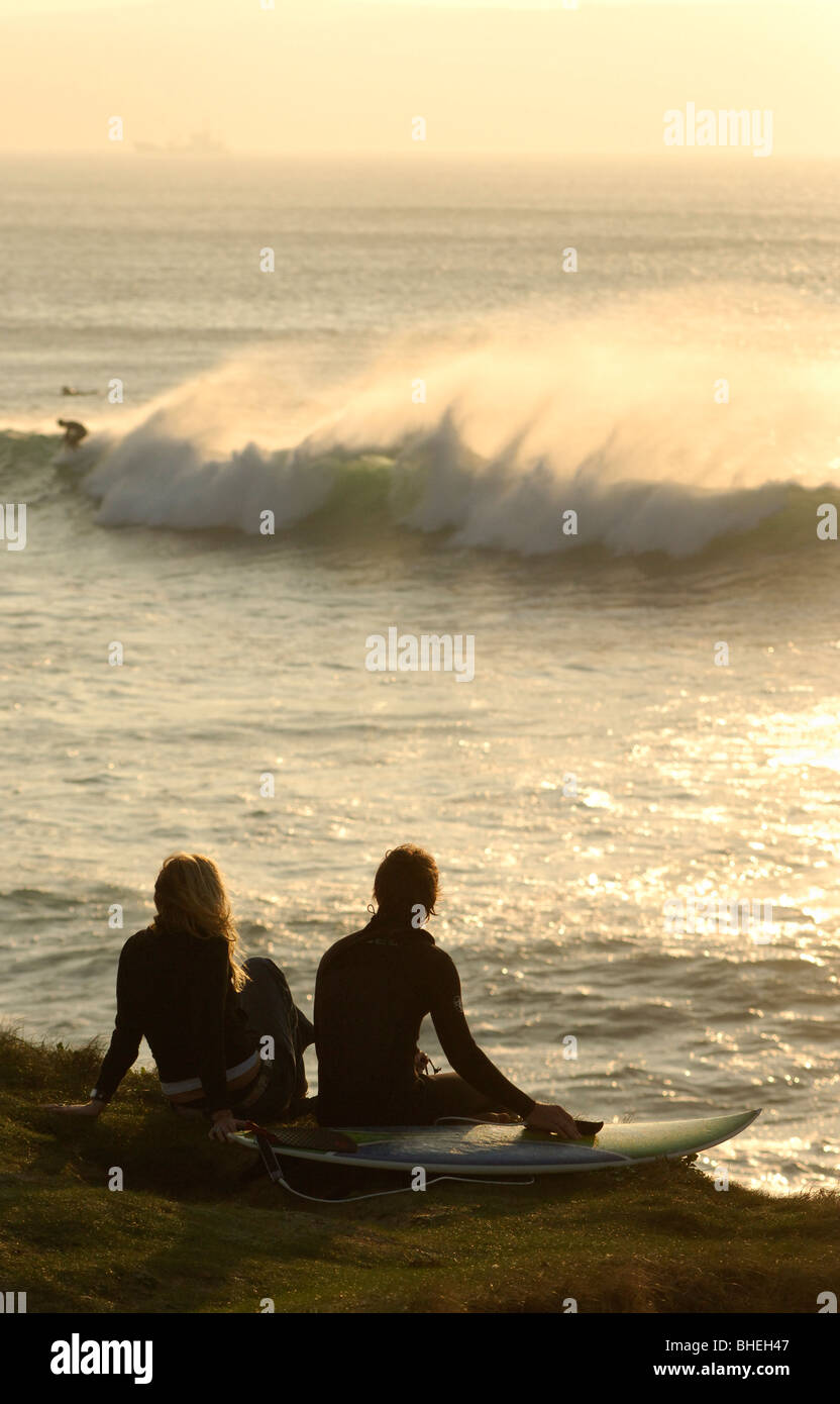 Girl sitting on surf board hi-res stock photography and images - Alamy