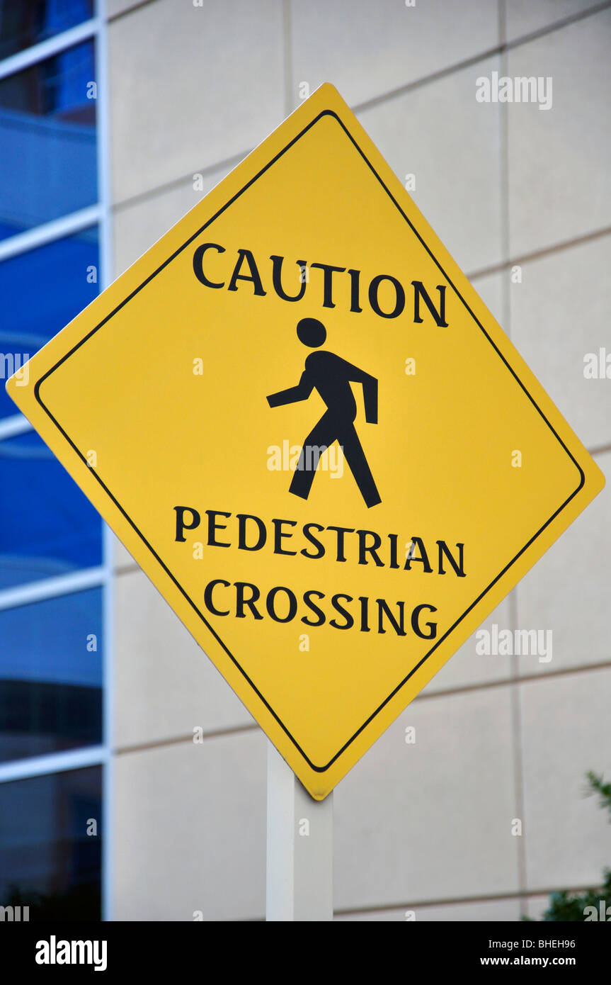 Pedestrian Crossing warning road sign Stock Photo - Alamy