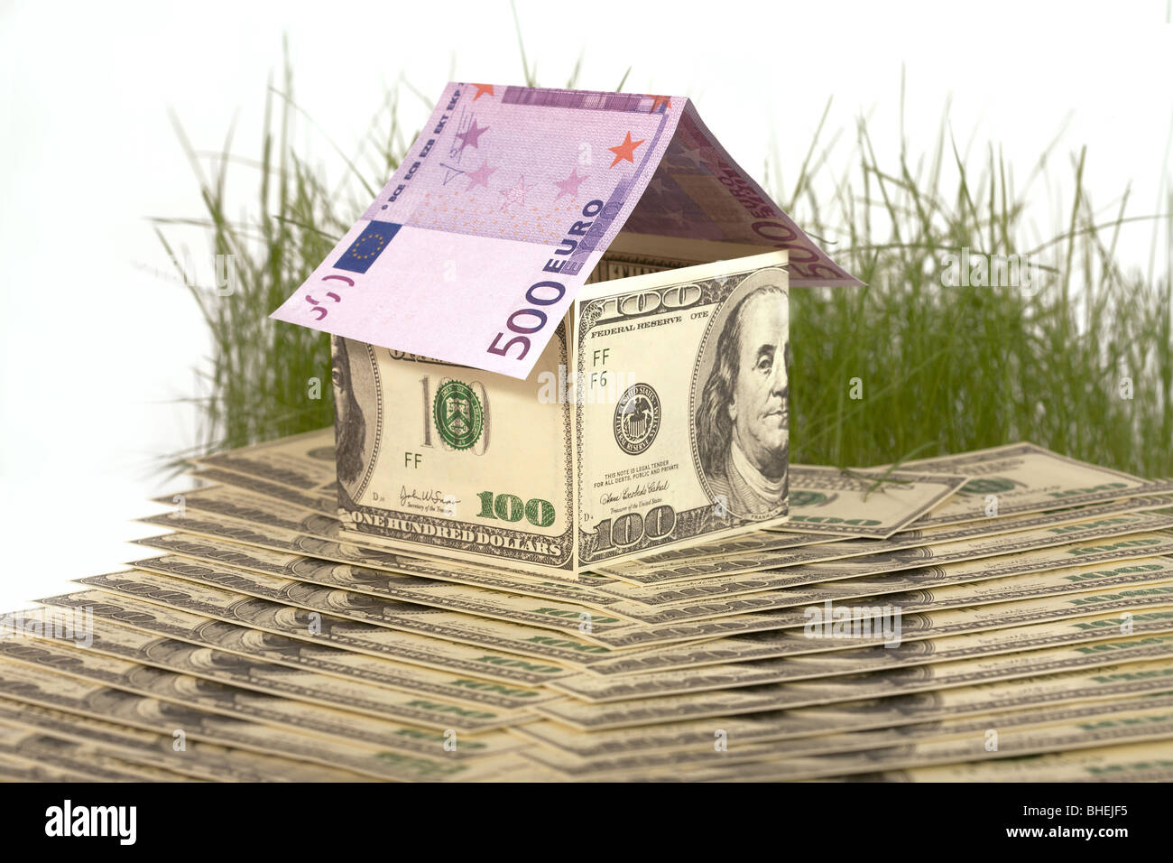 Symbolical house from banknotes of dollars and euro Stock Photo - Alamy