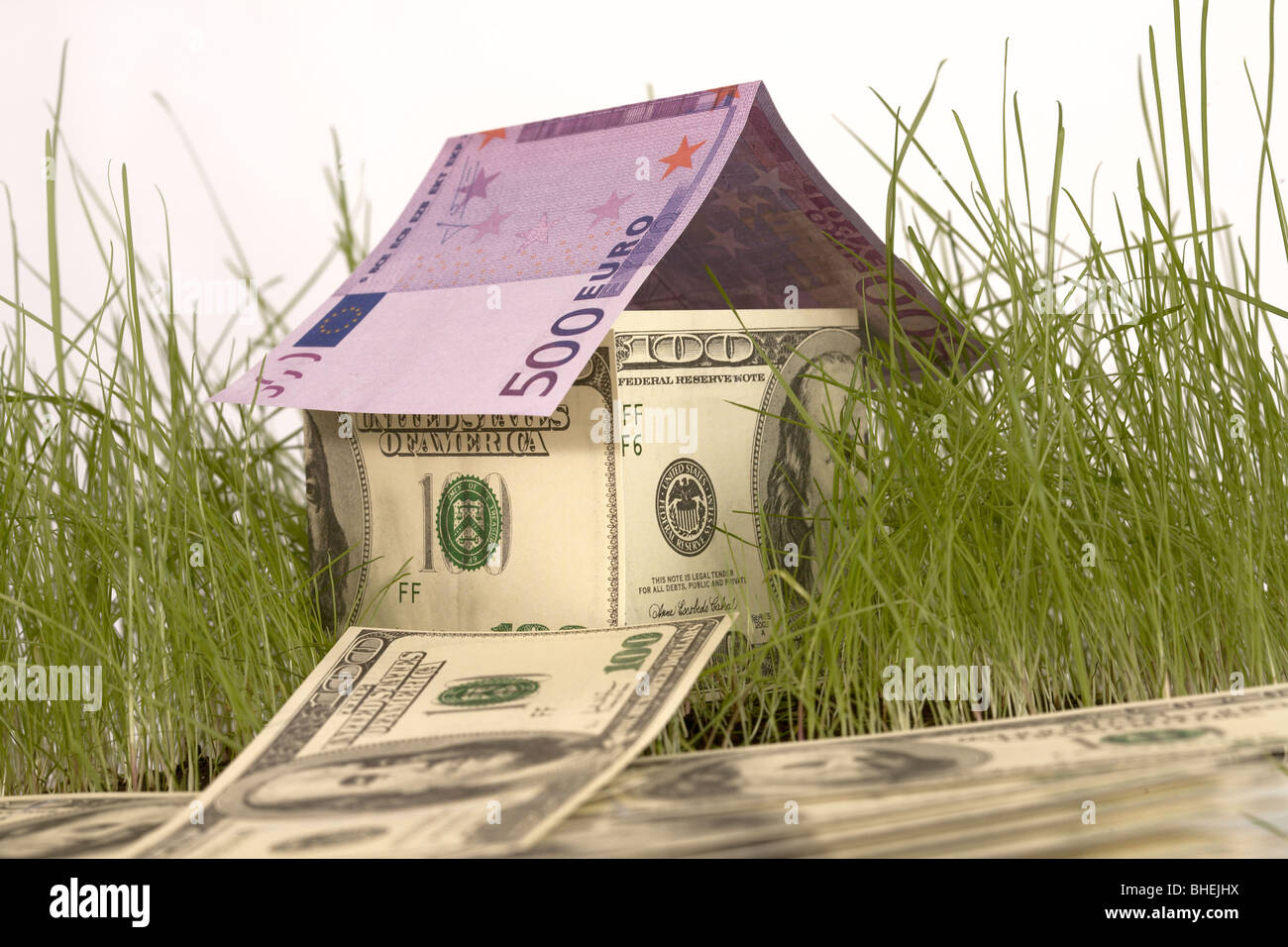 Symbolical house from banknotes of dollars and euro Stock Photo - Alamy