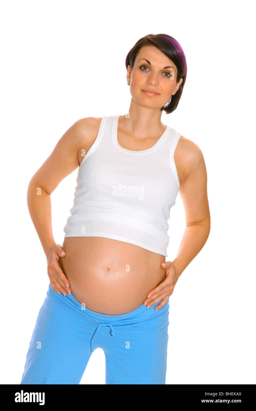 A pregnant woman showing here big bare belly Stock Photo - Alamy