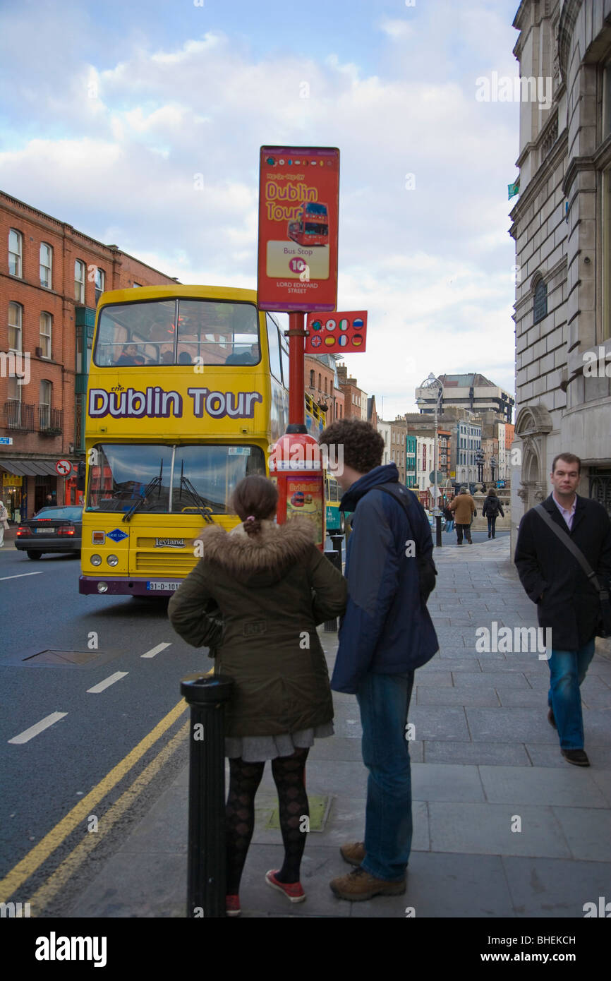 Tourist waiting at Dublin Tour bus stop. Dublin. Ireland Stock Photo ...