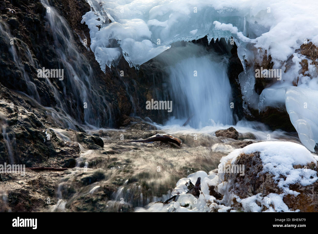 A small waterfall in the winter Stock Photo - Alamy