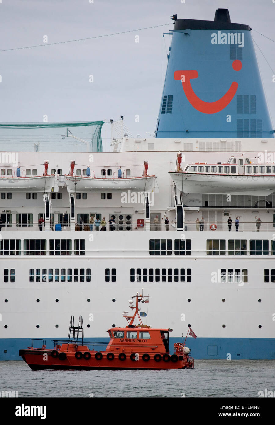 A Thomson cruise vessel and a pilot boat Stock Photo - Alamy