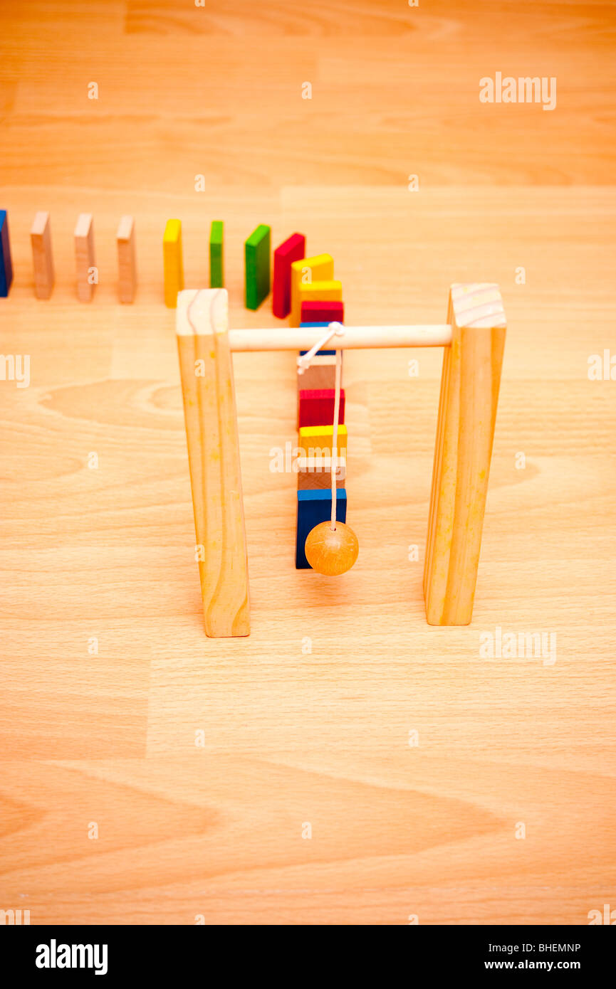 The starting point of a dominoes run where each wooden brick knocks ...