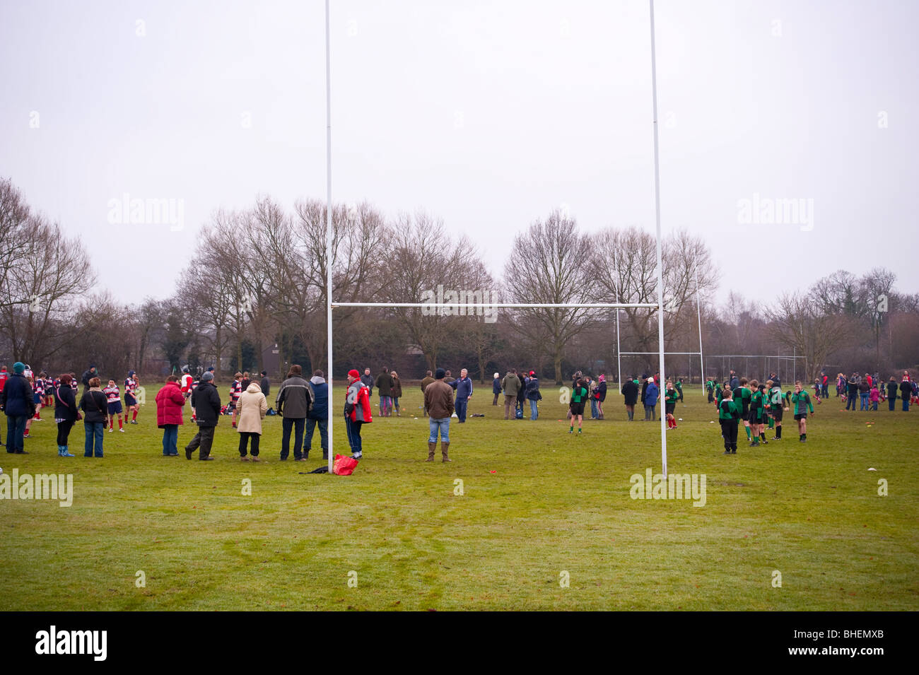 Children play rugby on a Sunday morning overlooked by their parents in ...
