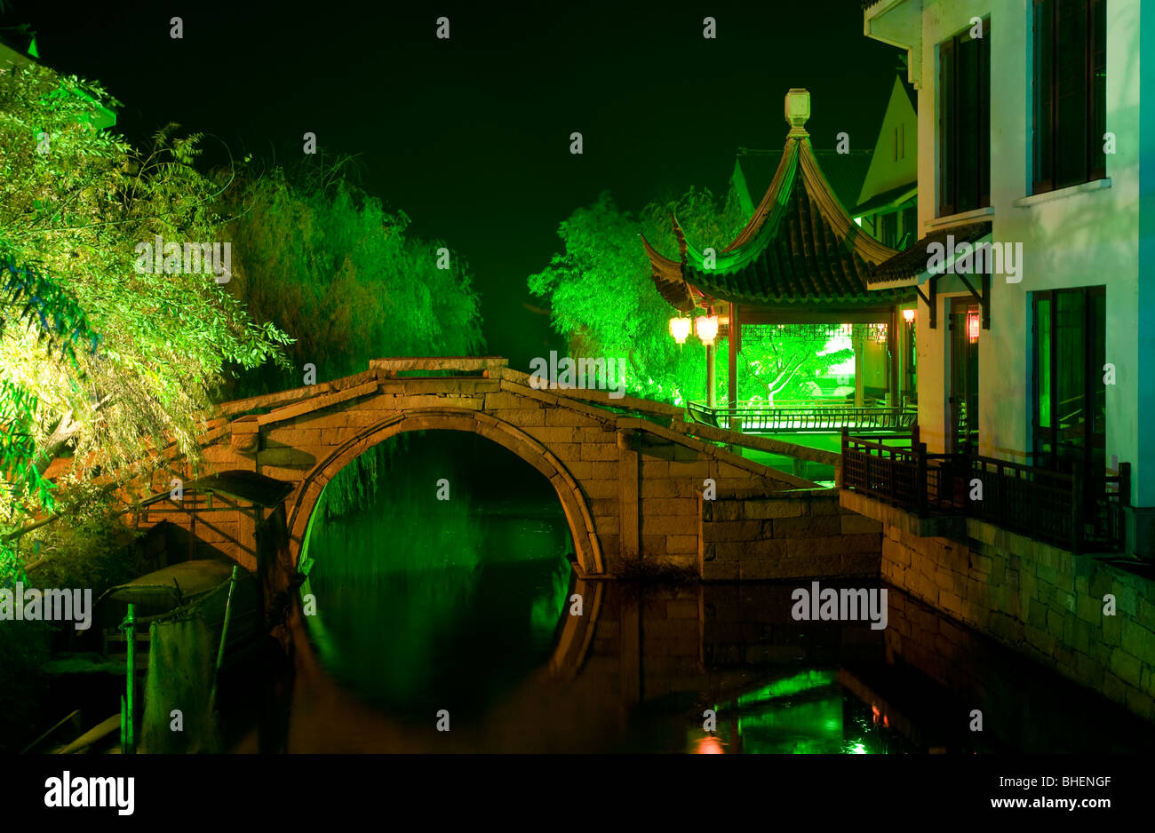 Stone arch bridge over a canal in Zhouzhuang, Jiangsu province, China ...