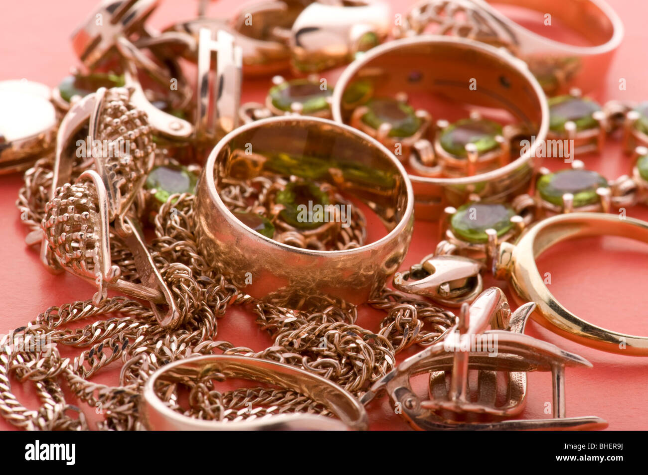 object on red - Gold jewel close up Stock Photo - Alamy