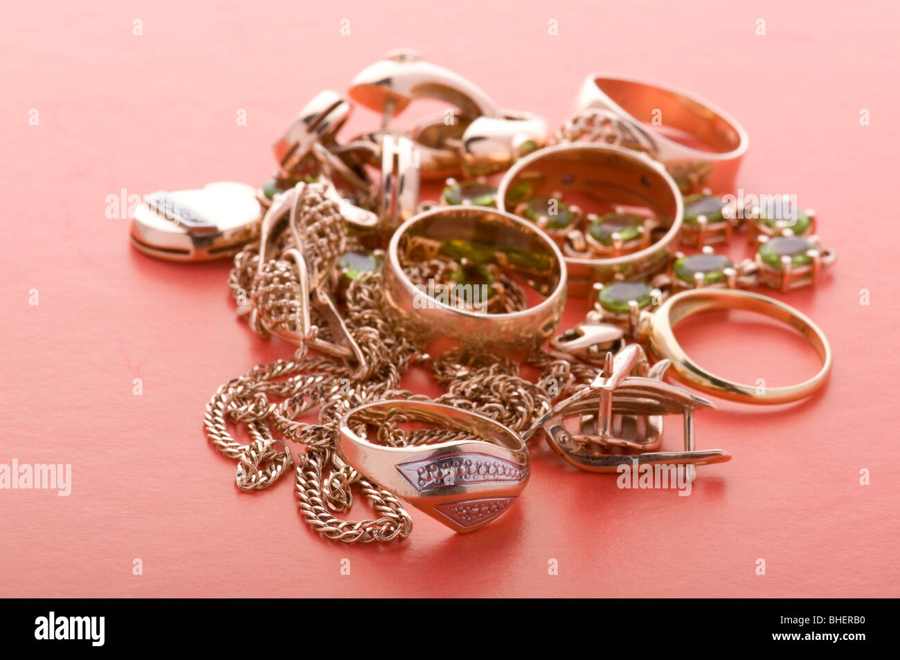 object on red - Gold jewel close up Stock Photo - Alamy