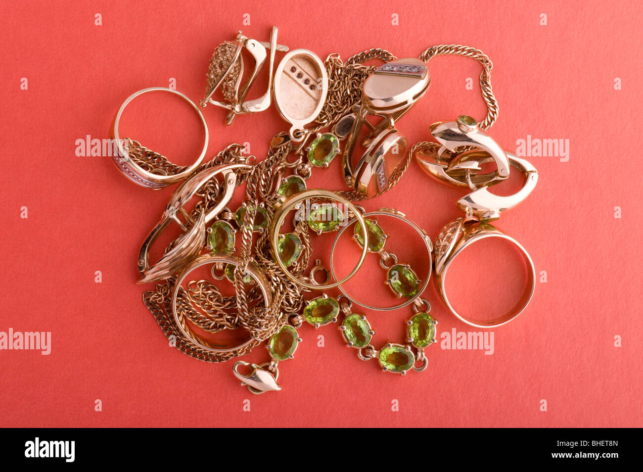 object on red - Gold jewel close up Stock Photo - Alamy