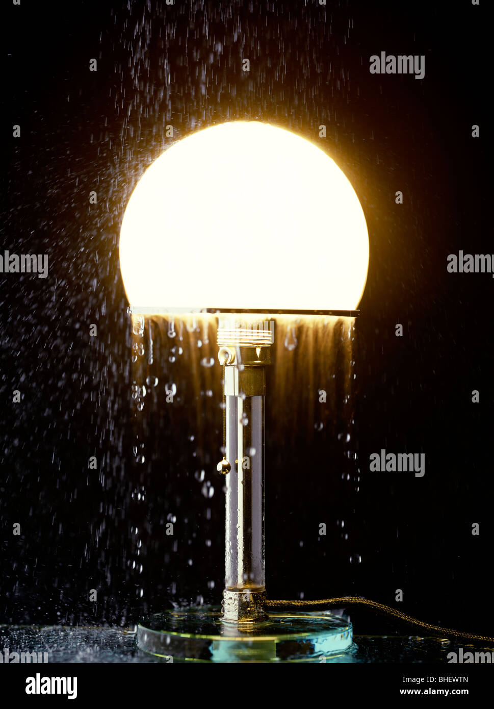 Water shower over Lamp Stock Photo - Alamy