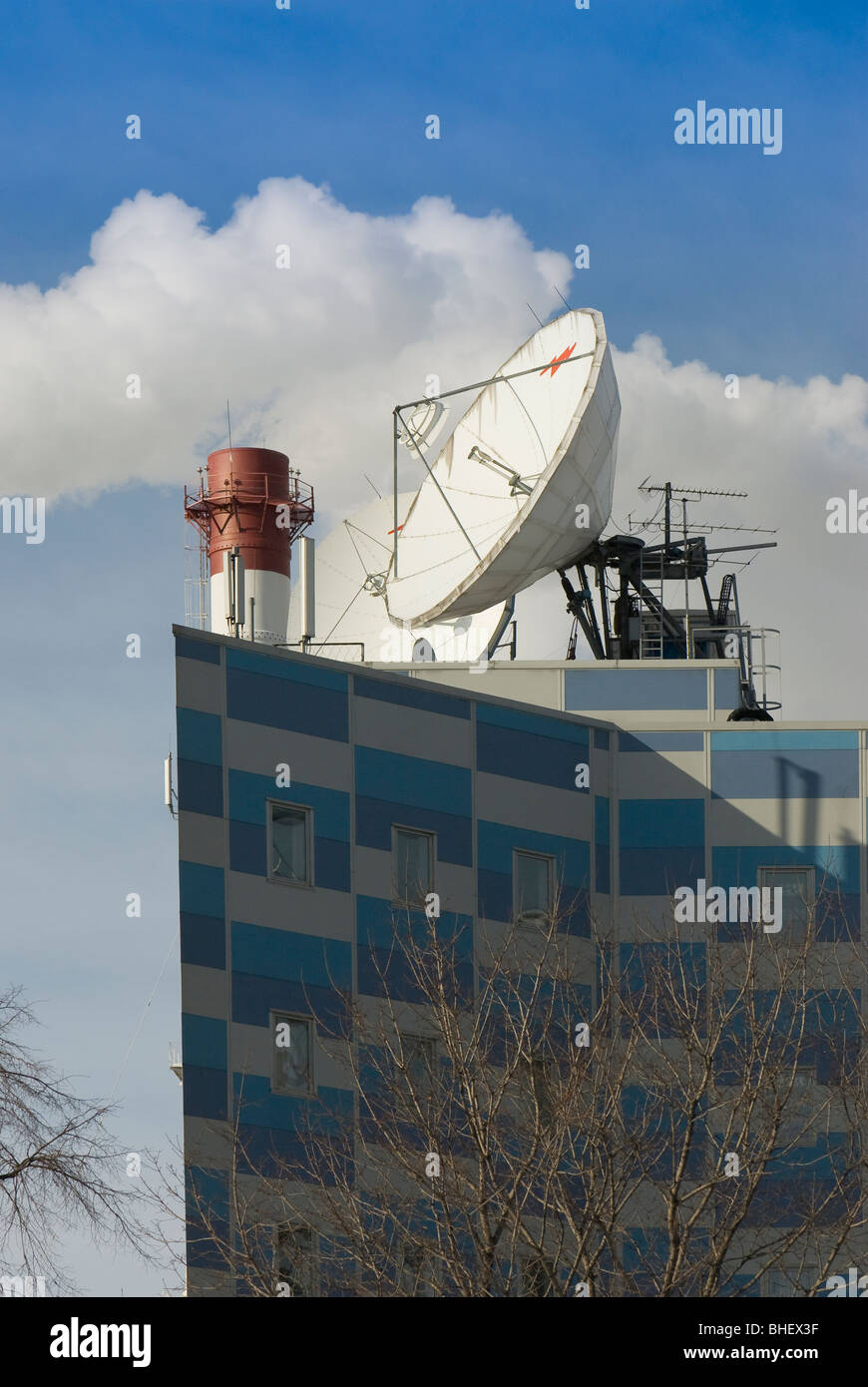 Heating plant pipes and satellite dishes Stock Photo - Alamy