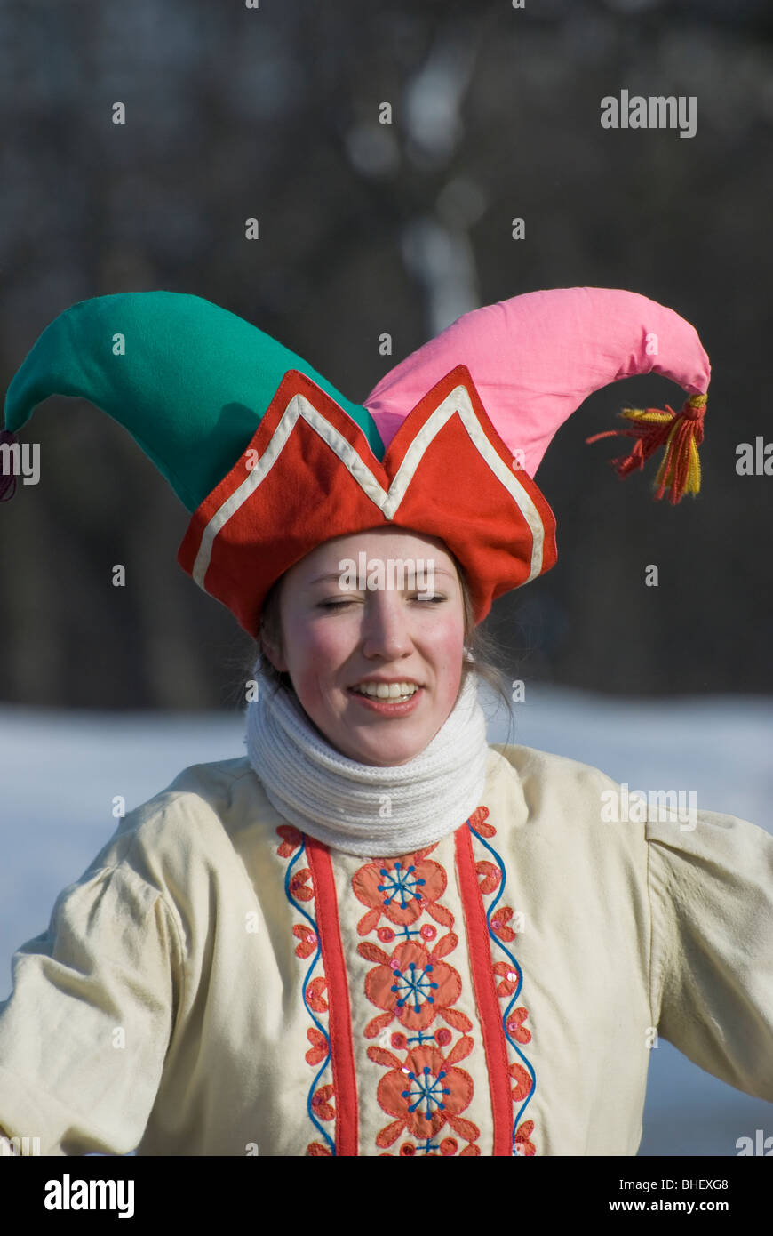 Smiling young girl in traditional Russian suit during celebration of ...