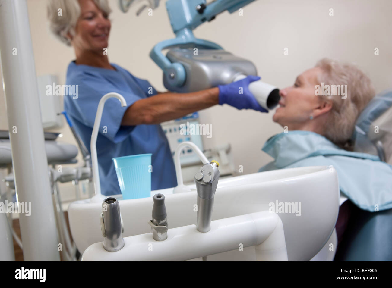 Female dentist taking X-Ray of her patient Stock Photo - Alamy