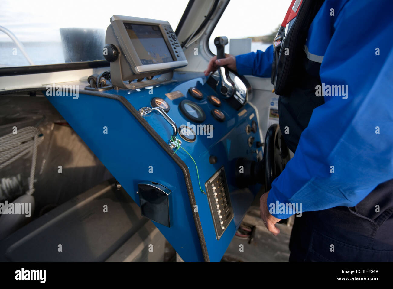 Security guard controlling a boat Stock Photo - Alamy