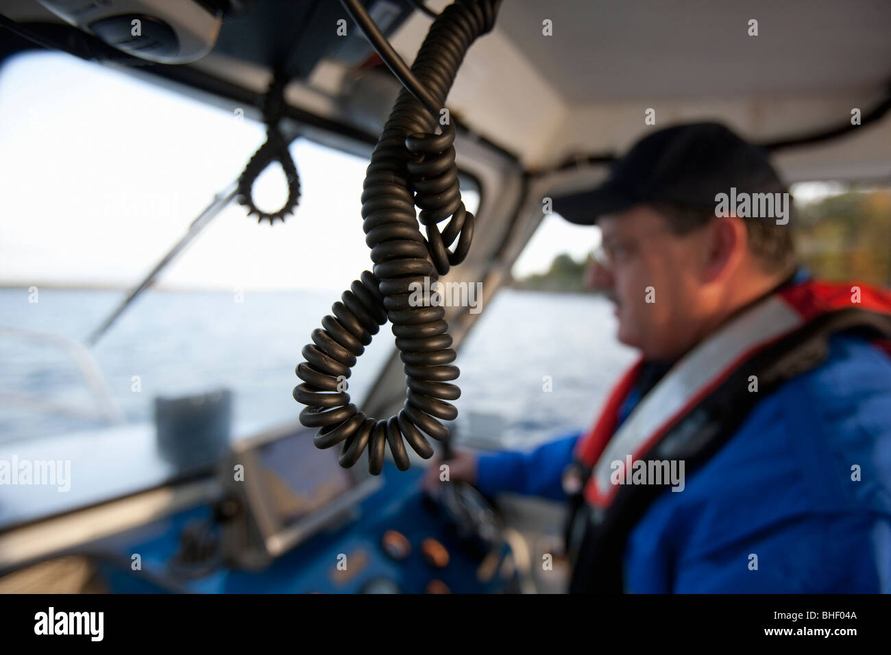 Security guard controlling a boat Stock Photo - Alamy