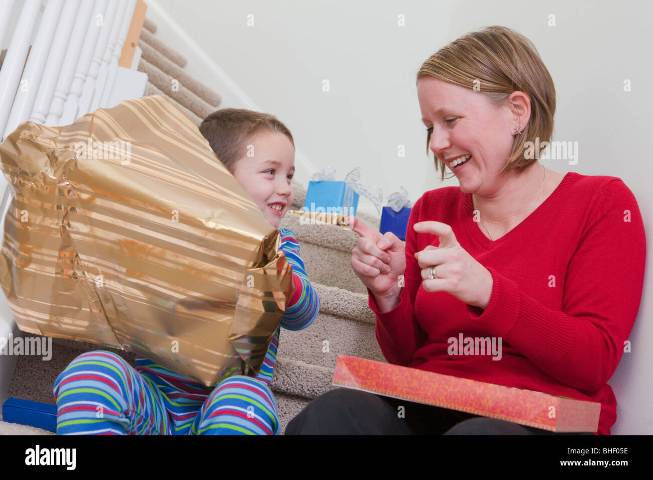 Woman signing the word 'Gift' in American Sign Language while ...