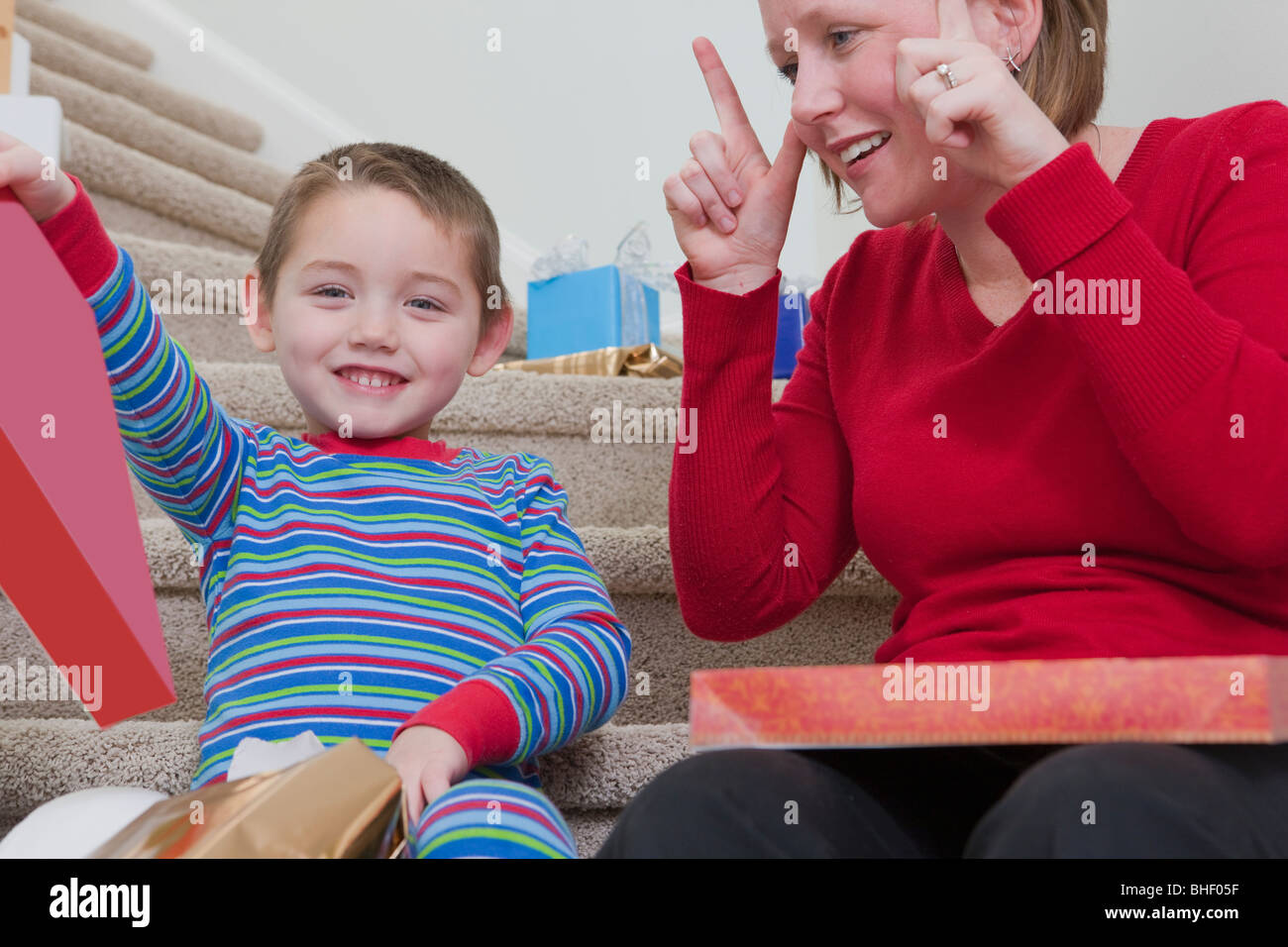Woman signing the word 'Surprise' in American Sign Language while ...