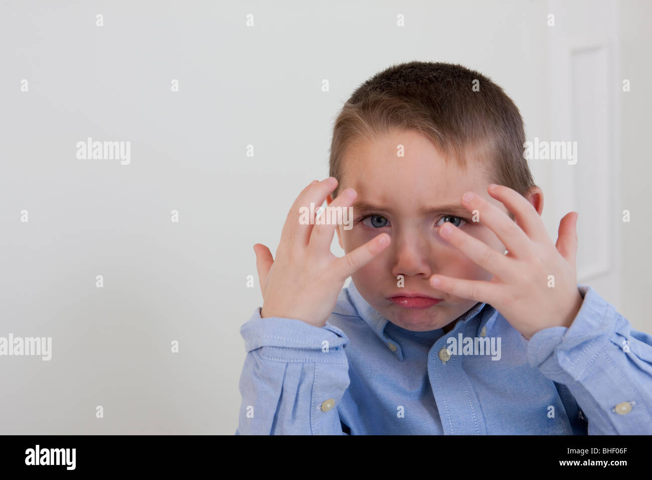 Boy signing the word 'Sad' in American Sign Language Stock Photo - Alamy