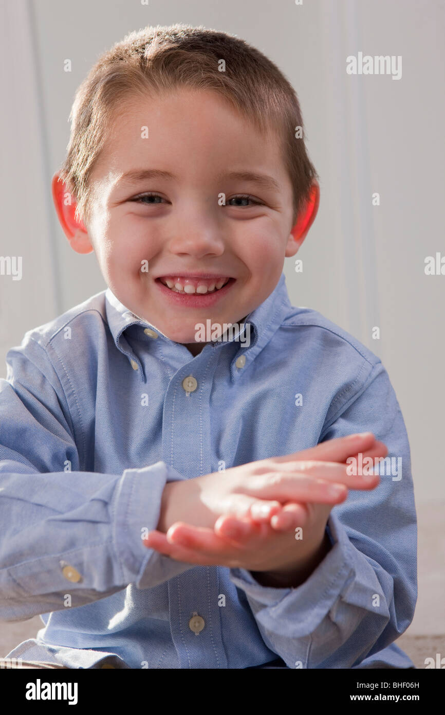 Boy signing the word 'School' in American Sign Language Stock Photo - Alamy