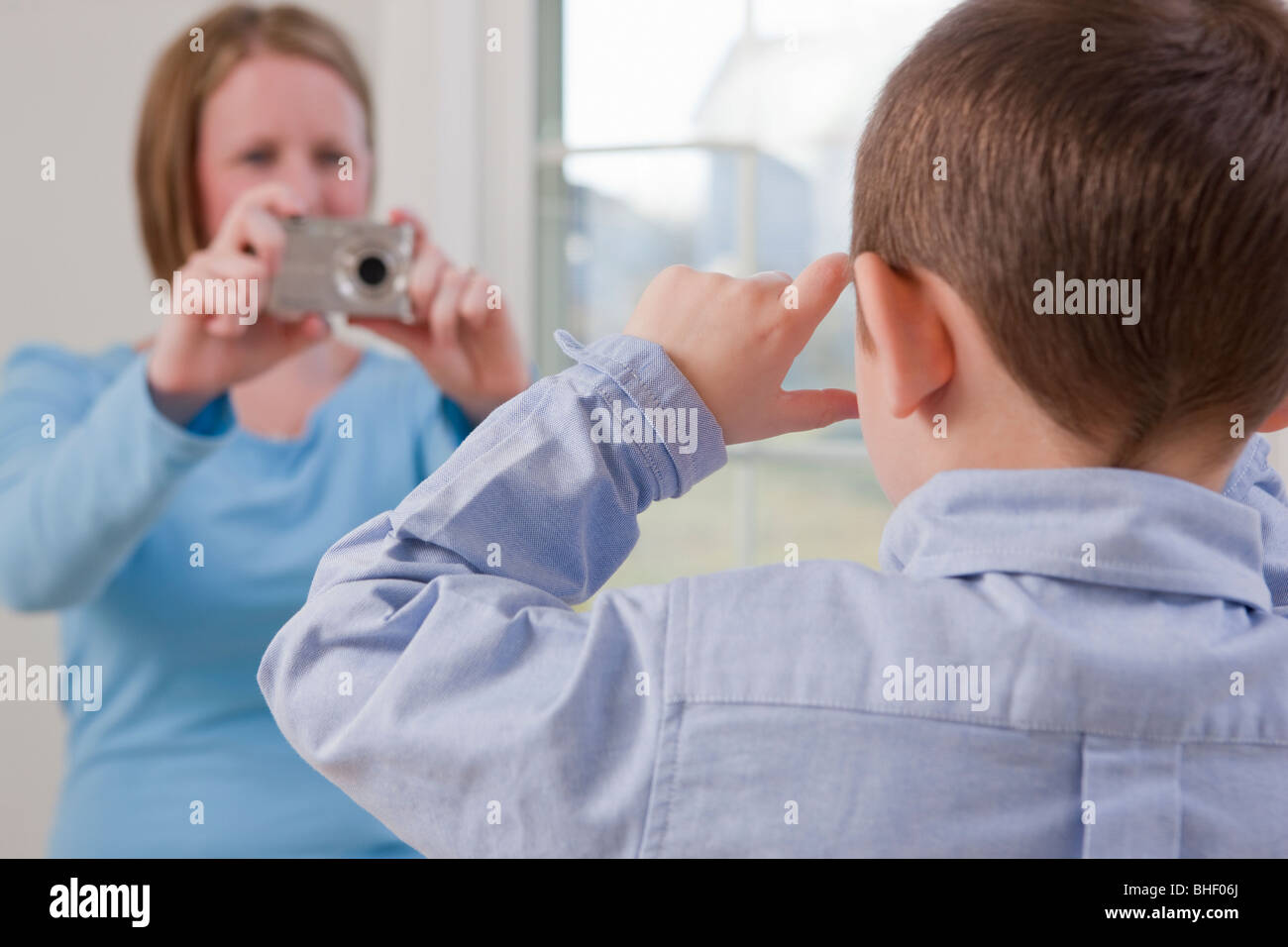 Boy signing the word 'Picture' in American Sign Language while his ...