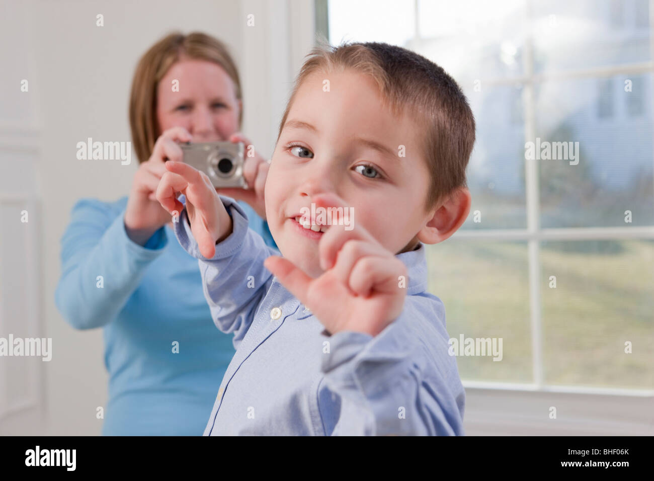 Boy signing the word 'Picture' in American Sign Language while his ...