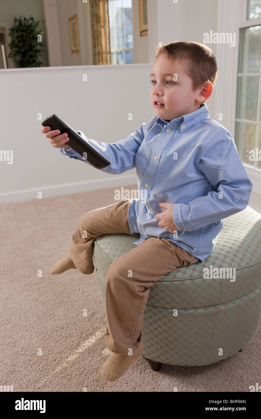 Boy operating a remote control Stock Photo - Alamy