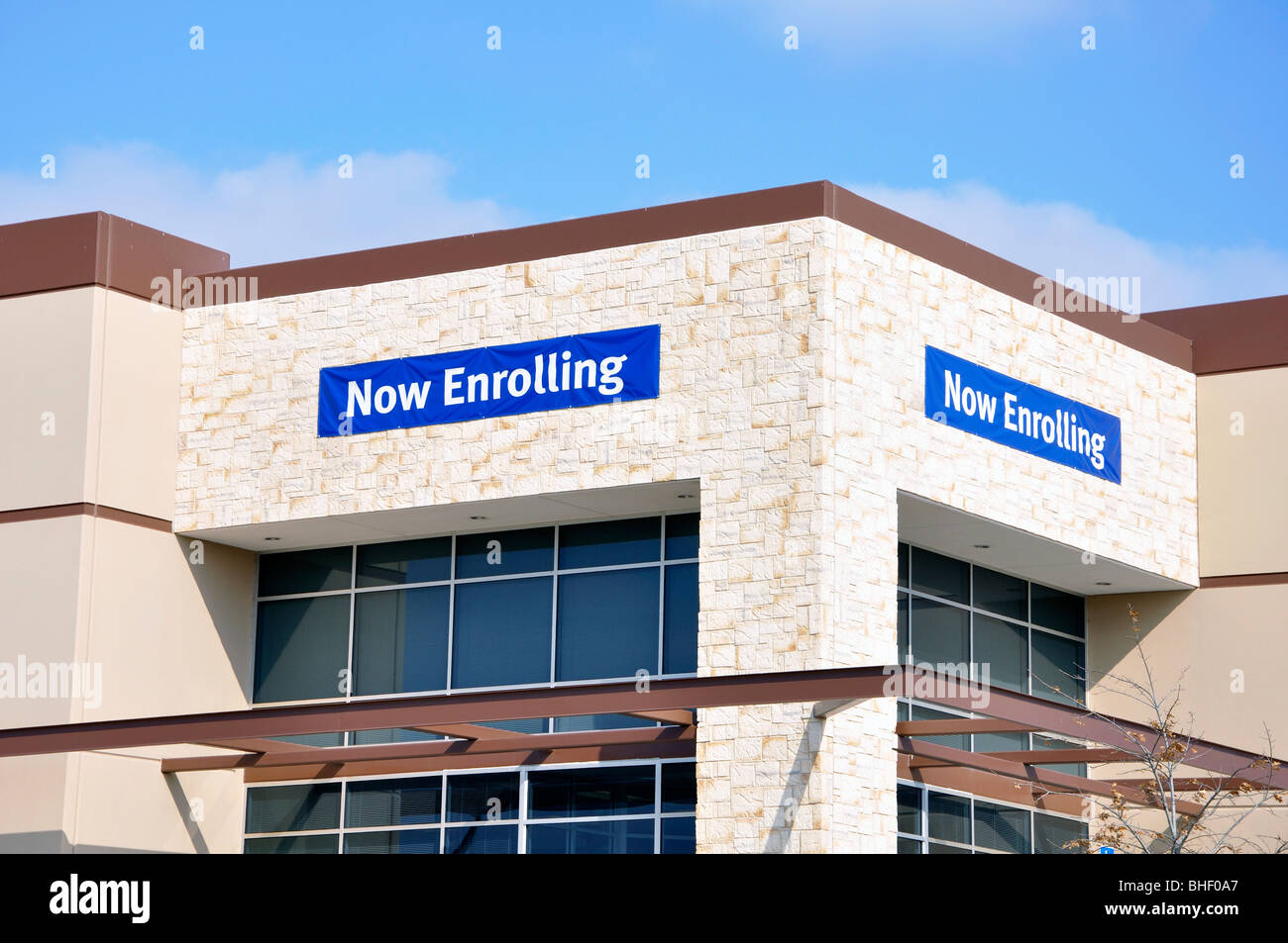Now Enrolling sign on school, USA Stock Photo - Alamy