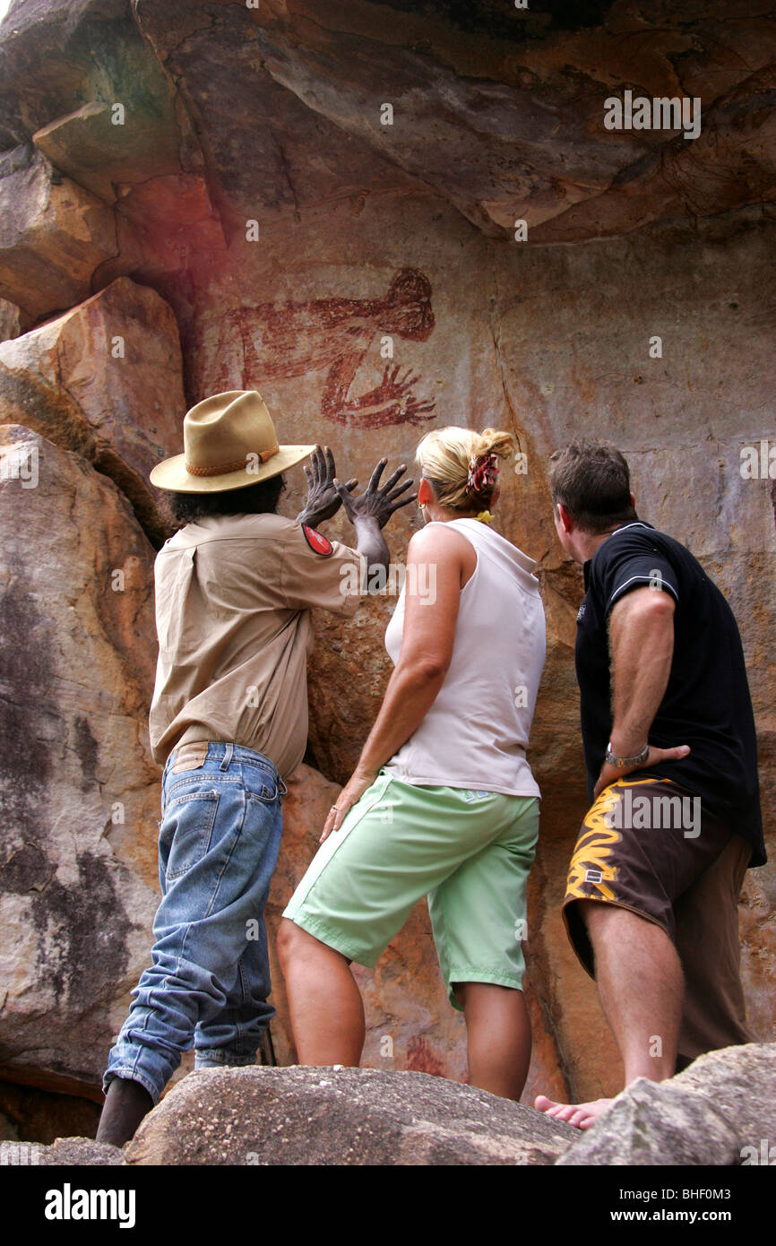 Aboriginal elder Peter Bolgi interprets rock art at a cultural site in ...