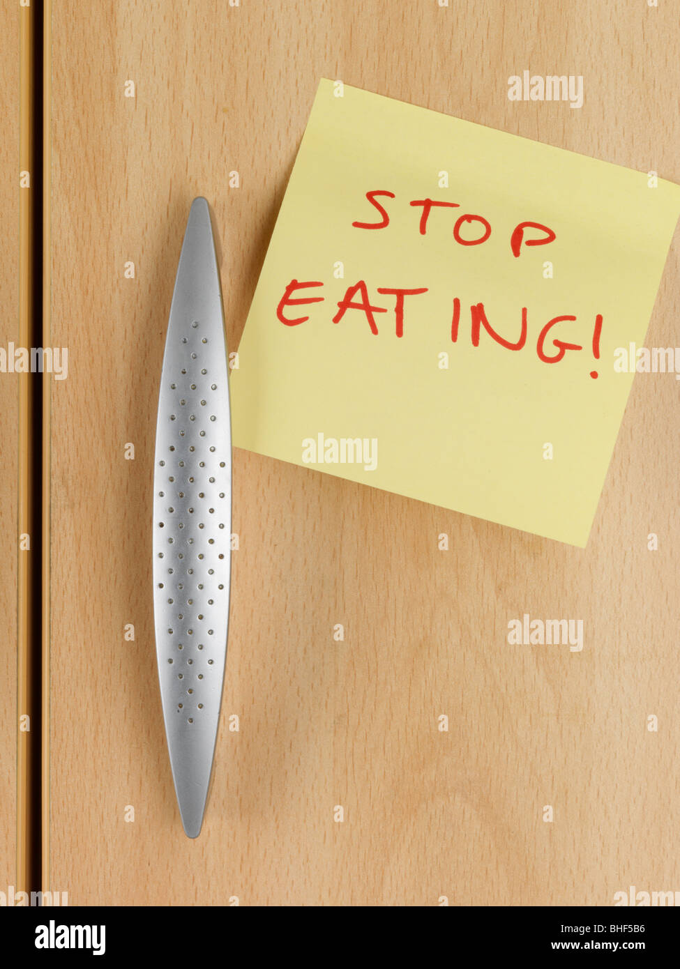 Stop Note on Cupboard Stock Photo - Alamy