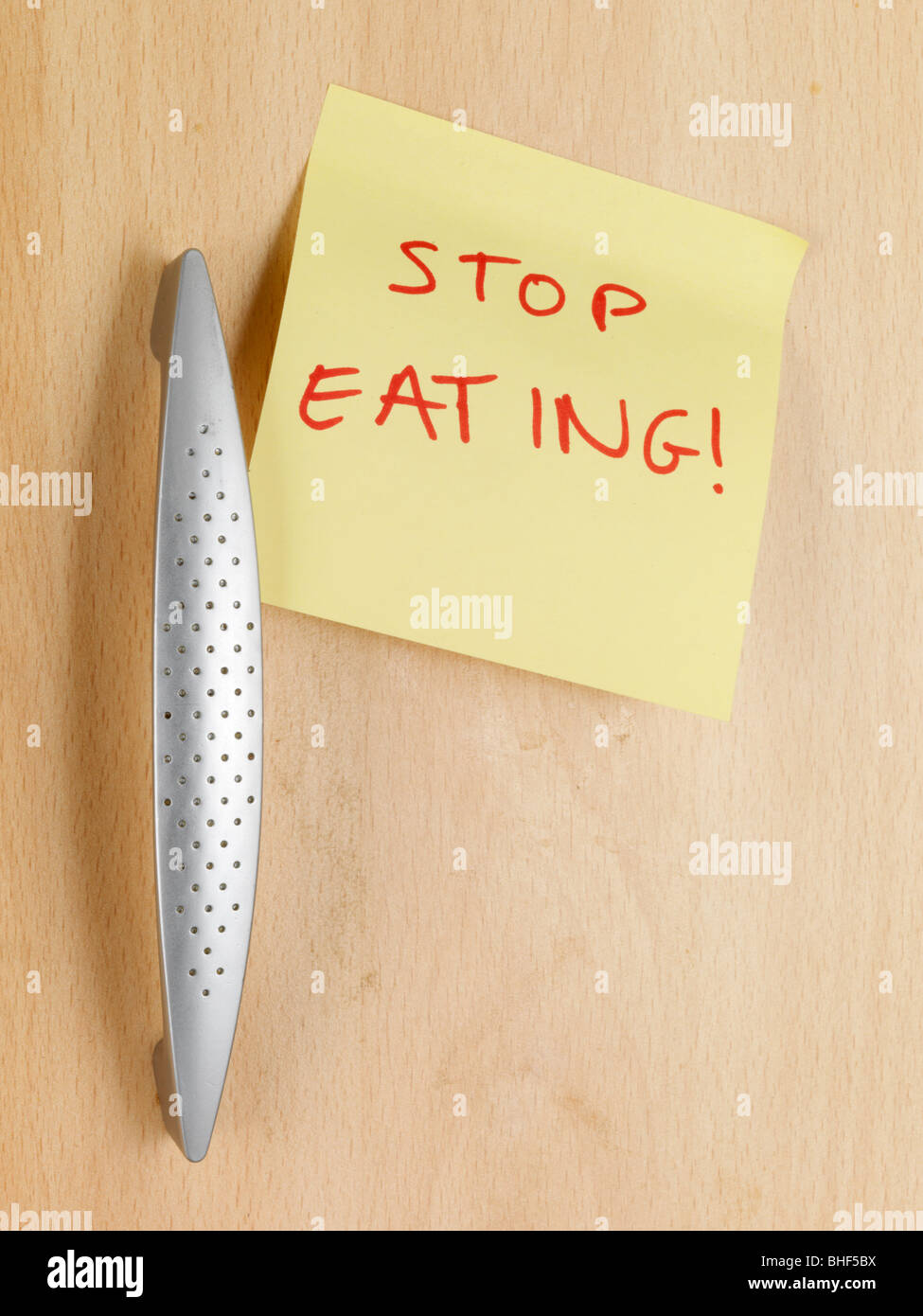 Stop Note on Cupboard Stock Photo - Alamy