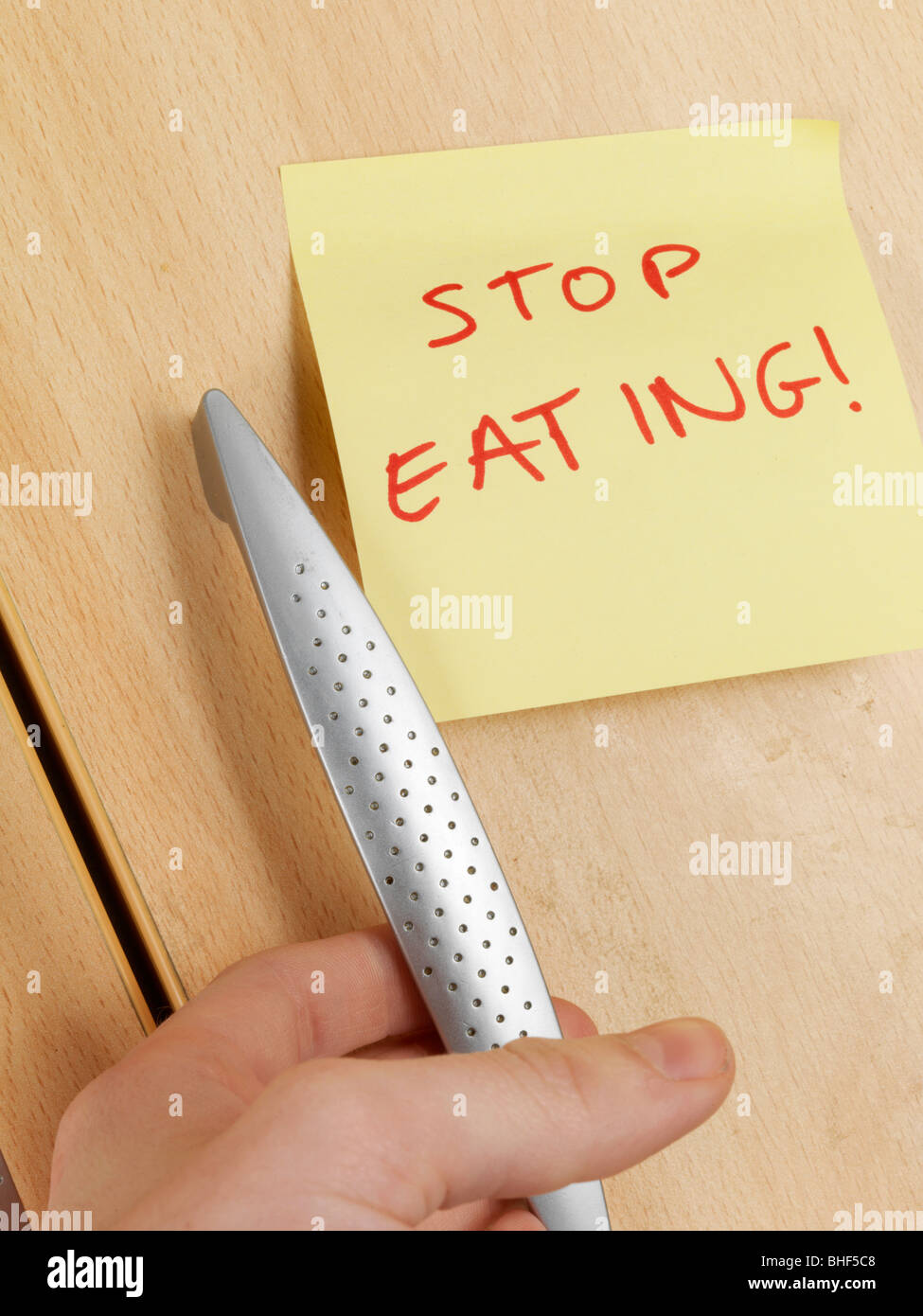 Stop Note on Cupboard Stock Photo - Alamy