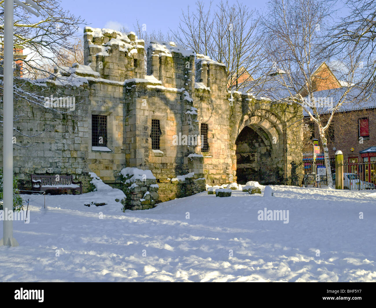 Snow covered chapel ruins of St Leonards Hospital in winter weather ...